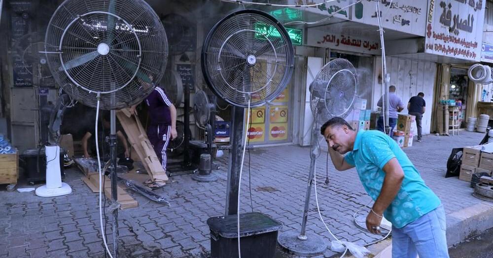 Man in Iraq stops at outdoor shower in heat | | wdrb.com