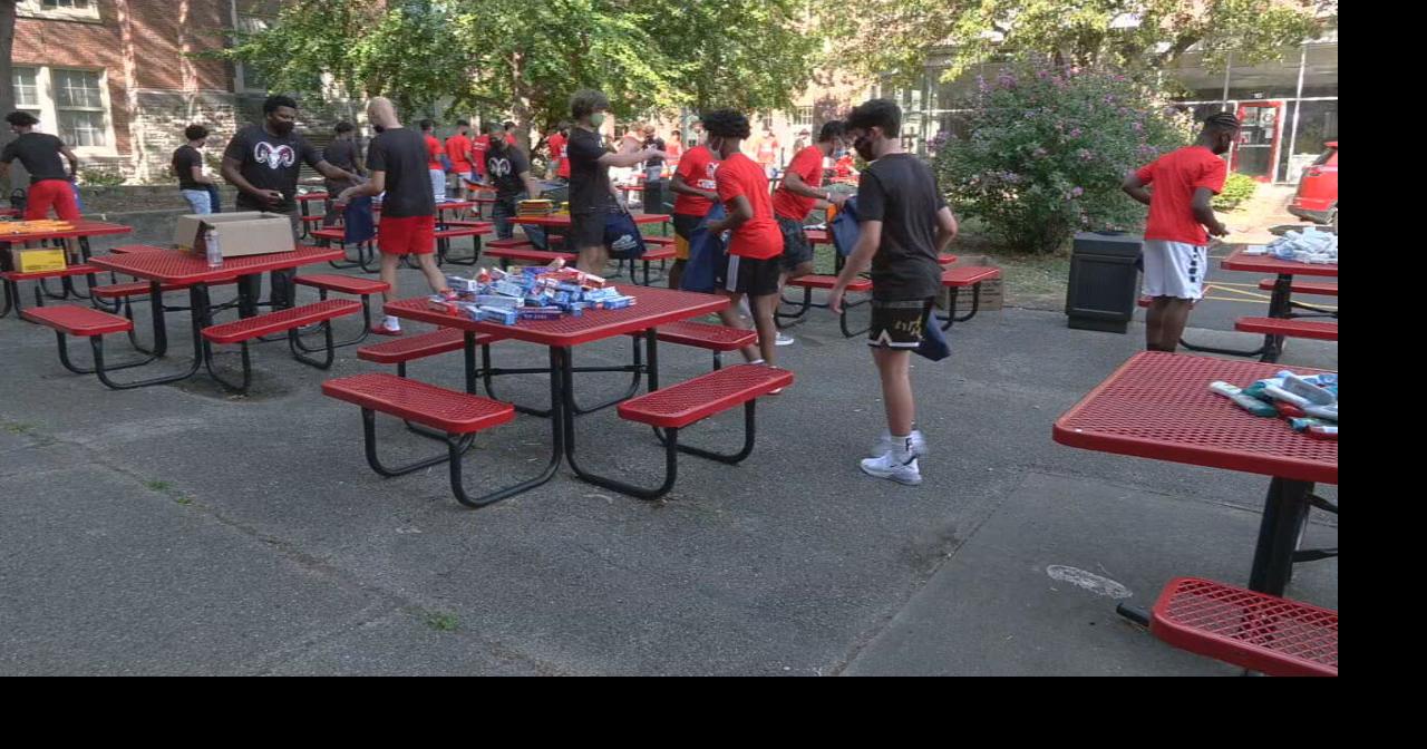 duPont Manual boy's basketball team gives back to orphans in West ...