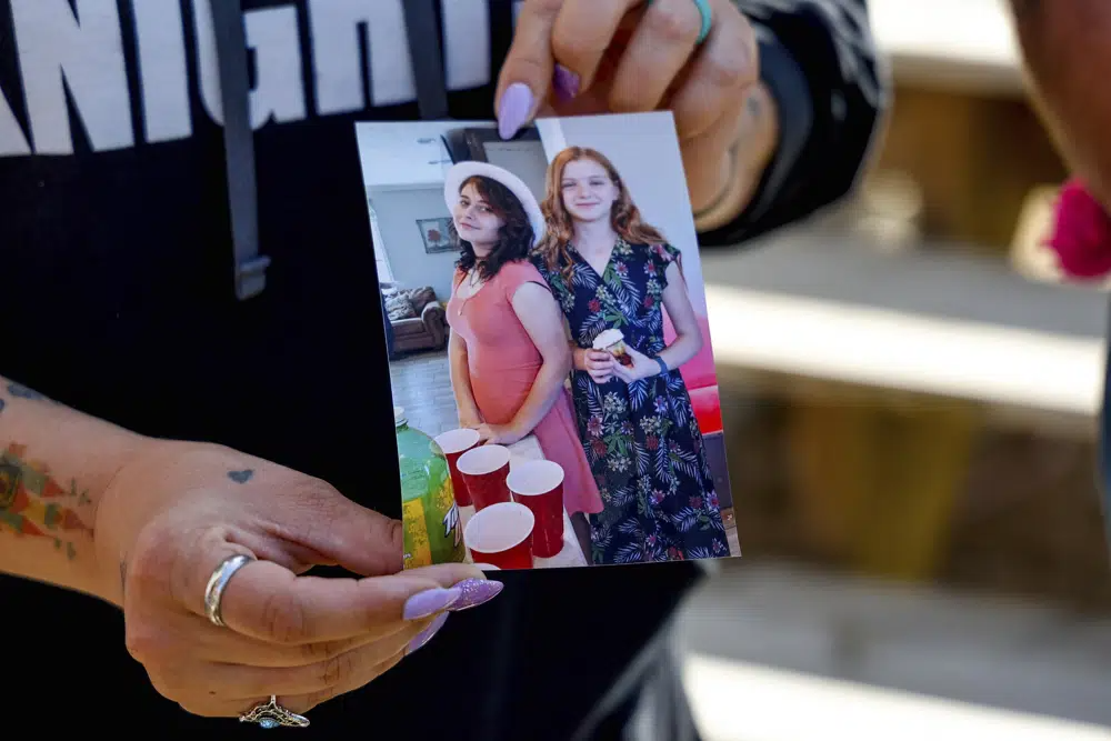 Ashleigh Webster with photo of Ivy Webster and Tiffany Guess | | wdrb.com