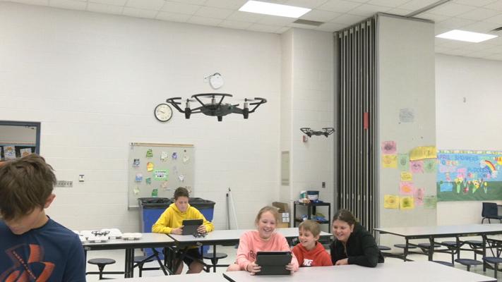 Buckner Elementary School students fly drones through cafeteria after ...