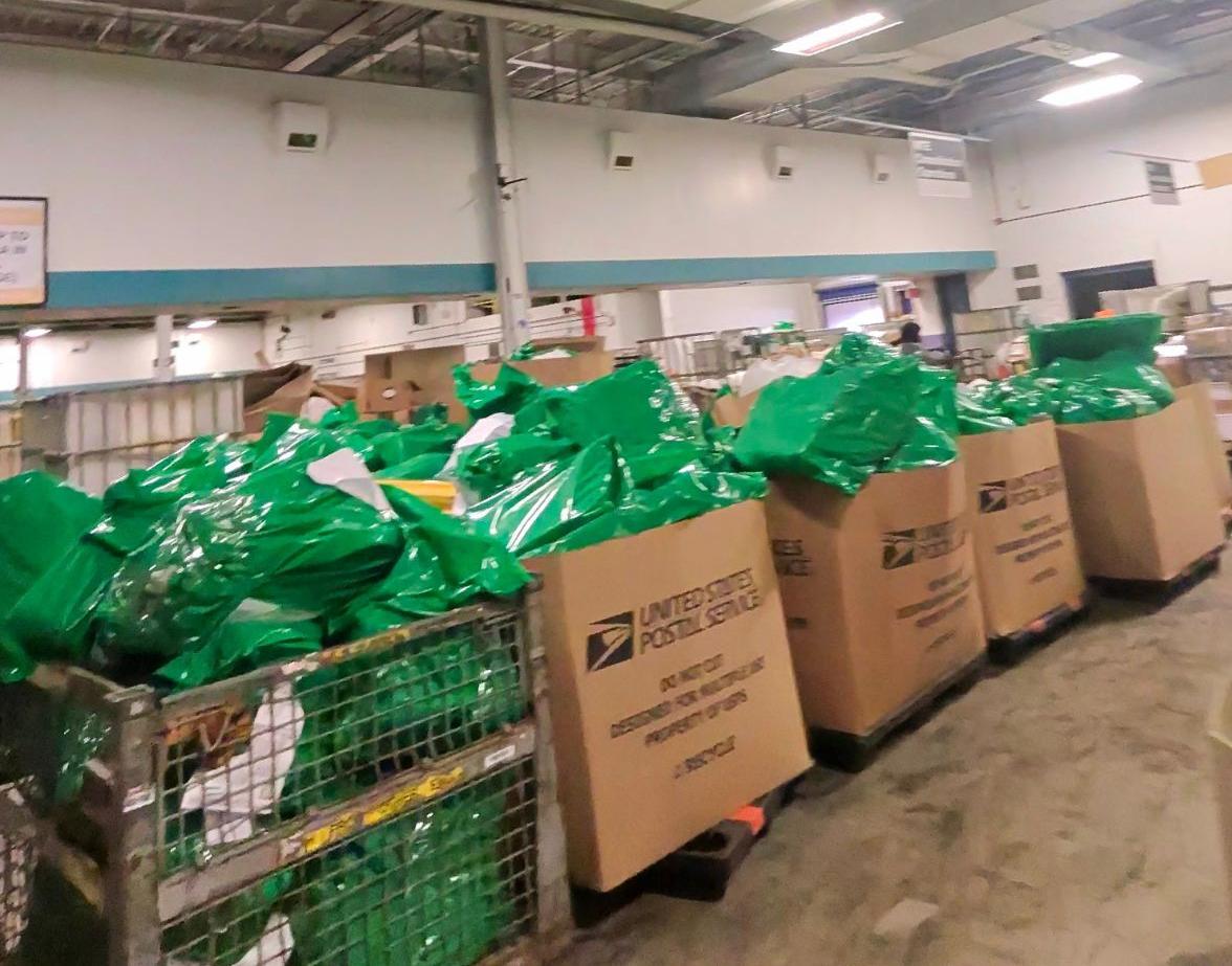 USPS employees show piles of packages, 'total chaos' inside Louisville ...