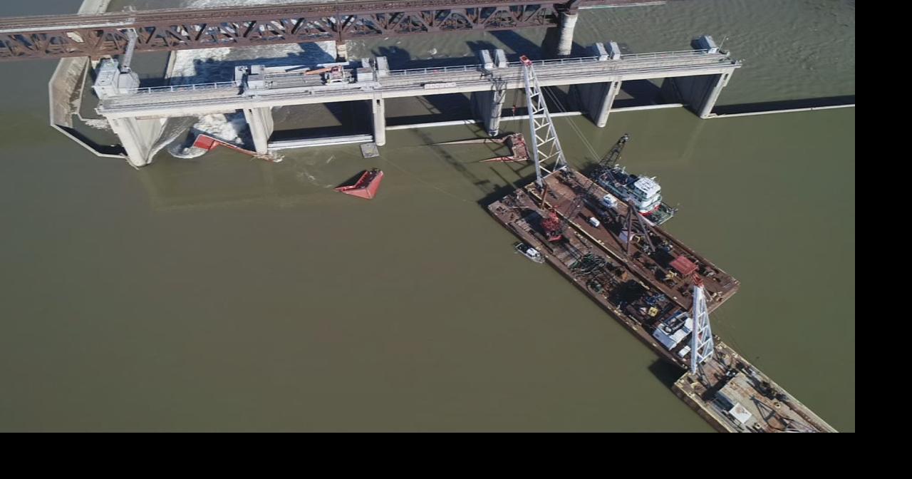 Barges pinned against McAlpine Dam still weeks away from being removed ...