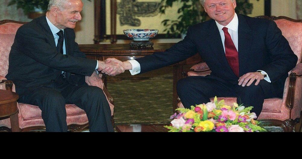 President Bill Clinton shakes hands with Syrian President Hafez Assad ...