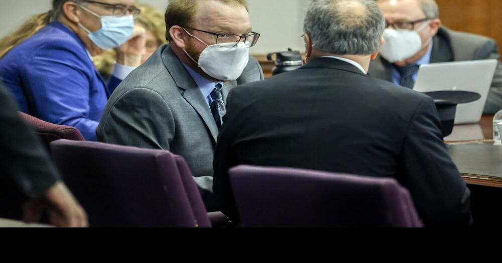 Travis McMichael speaks with his attorney Bob Rubin during the ...