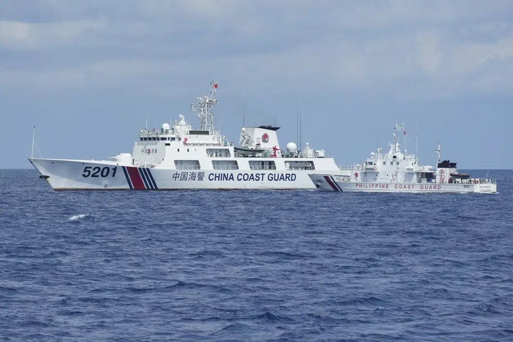 Chinese Coast Guard ship near Philippine Coast Guard ship | | wdrb.com