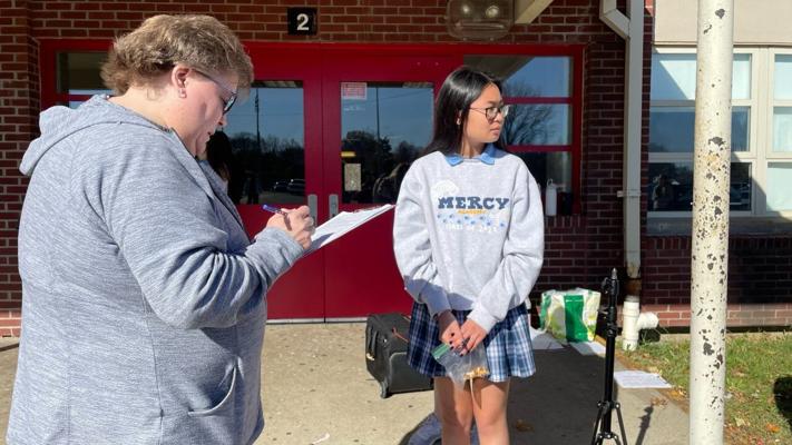Mercy Academy students conduct exit polls at Seneca High School voting ...
