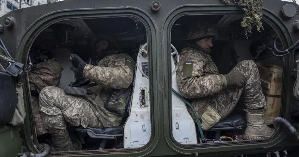 Ukrainian servicemen sit inside a APC.jpg | | wdrb.com
