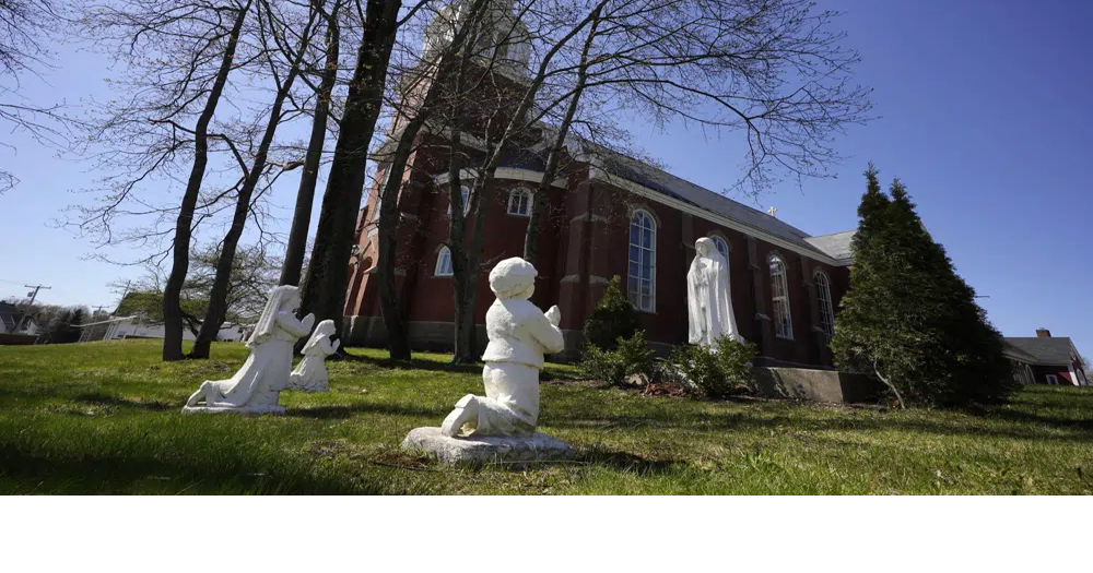 Statues of nuns praying outside Holy Family Catholic Church | | wdrb.com