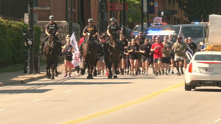 Law enforcement officials carry Torch of Hope through Louisville for ...