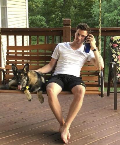 Travis Timmerman sits on a swing | | wdrb.com