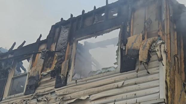 Firefighter taken to hospital after falling through floor during ...