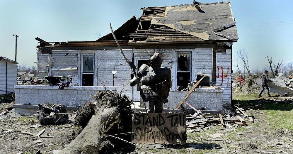 A statue of a knight standing tall after damaging tornado on 4.3.23 ...