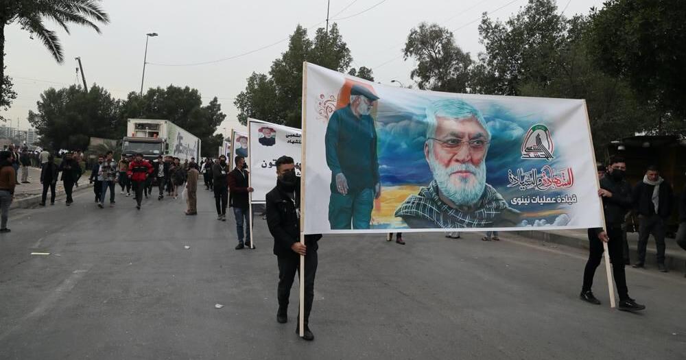 Popular Mobilization Forces march with posters | | wdrb.com