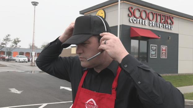 WDRB's Keith Kaiser helps people in line at Scooter's Coffee get ready ...