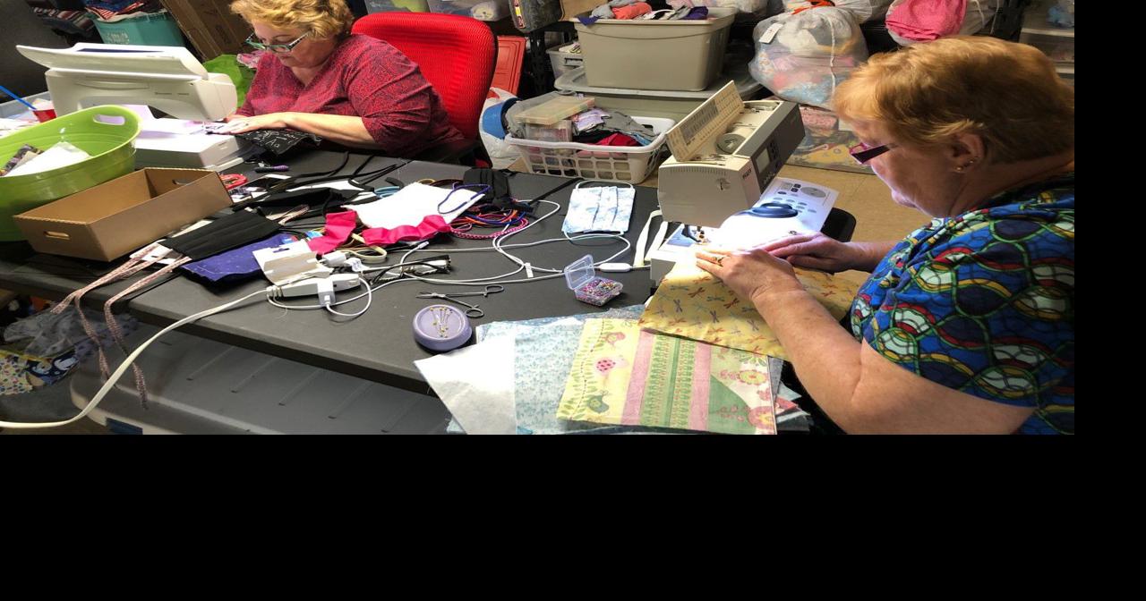 Growing army of people putting sewing machines to work making face ...