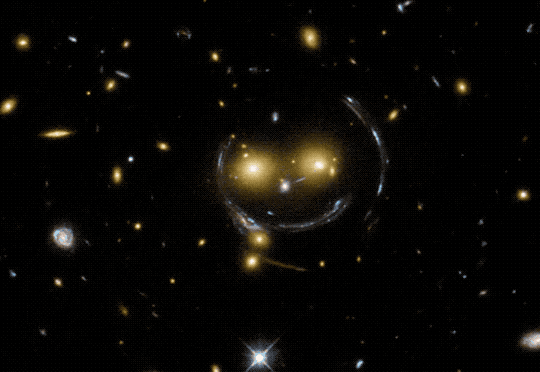 SMILE! This Galaxy Cluster Appears To Be Smiling Because Of ...