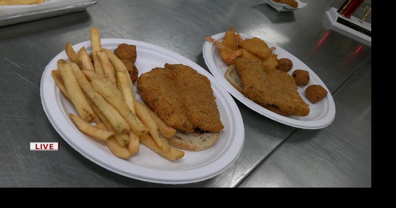 Keith Kaiser checks out the menu at St. Patrick's fish fry | | wdrb.com