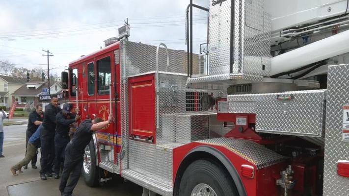Louisville firefighters celebrate new firetruck with traditional push ...