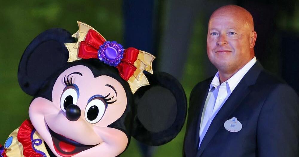 Disney Chairman Bob Chapek poses with Minnie Mouse | | wdrb.com