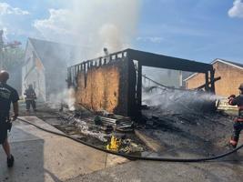 Garage fire in Fern Creek leaves multiple structures, vehicle heavily ...