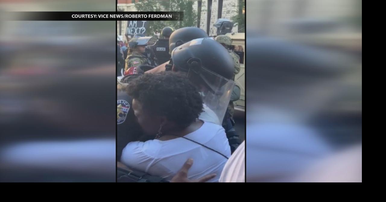 Powerful image of Louisville protester sharing hug with officer goes ...