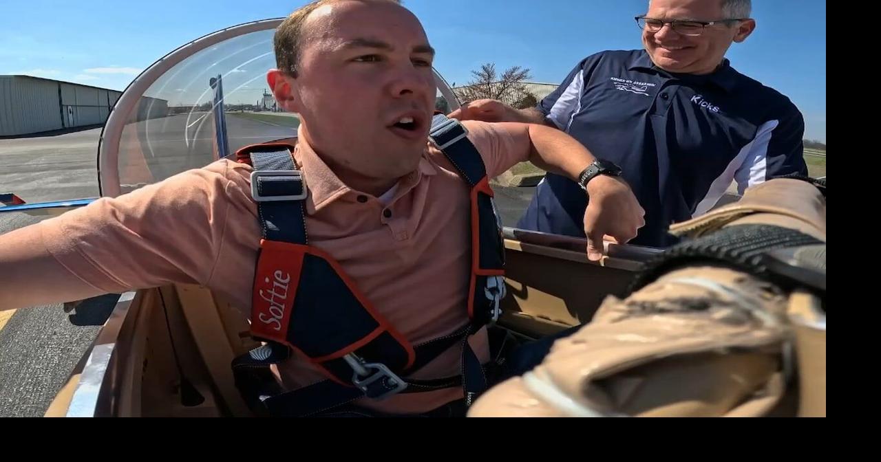 Dalton Godbey straps himself for a ride in a Thunder stunt plane for a ...