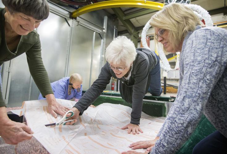 Raising the float | Volunteers prep for Apple Blossom Festival | Local ...