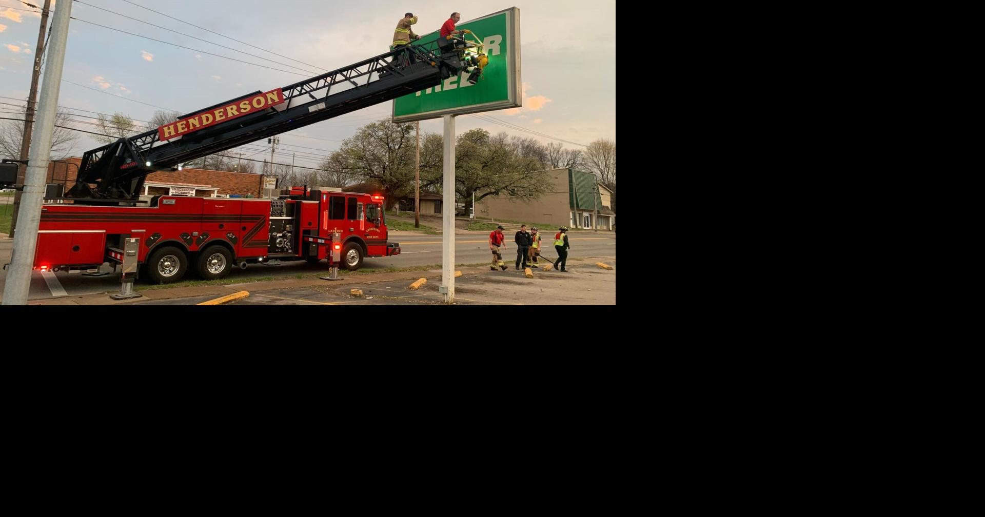 Henderson firefighters remove wind-damaged business sign | Kentucky ...