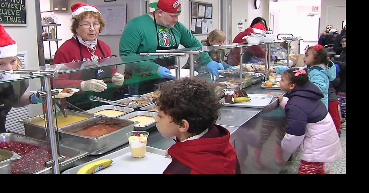 Volunteers serve brunch, hand out gifts to families at community ...