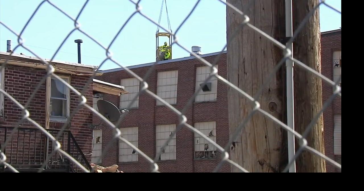 Demo crews surveying wall, organization offering mental health help ...