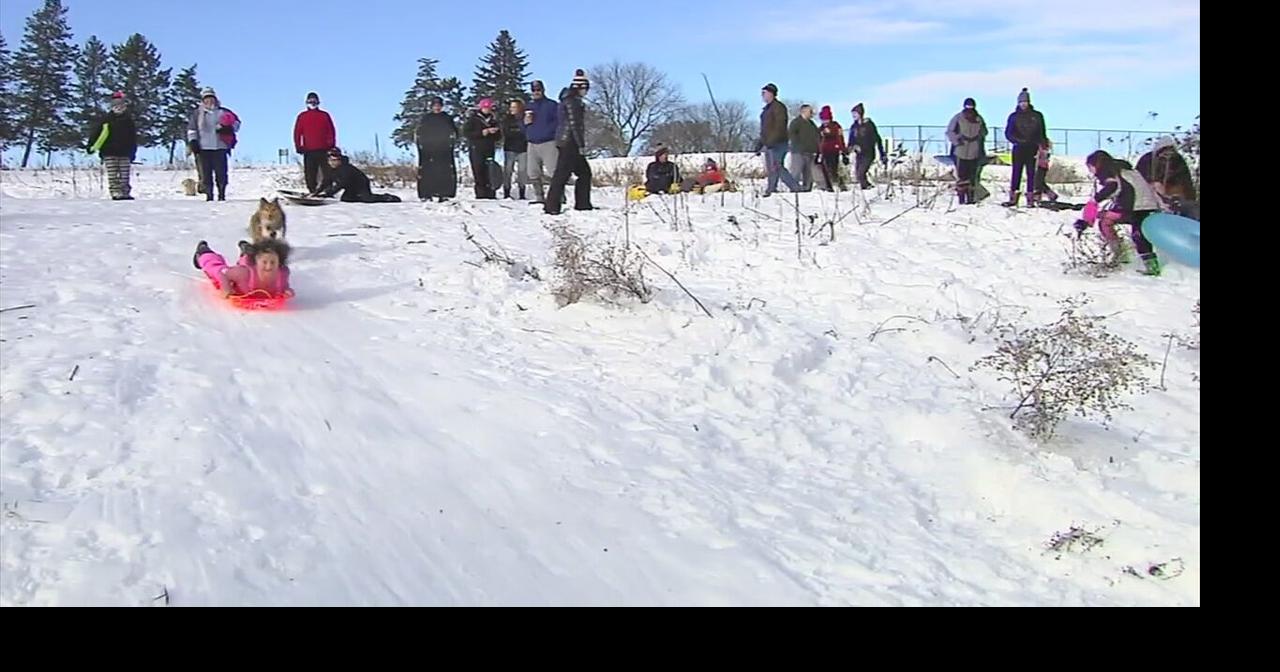 Families enjoy some good old-fashioned sledding after first storm of ...