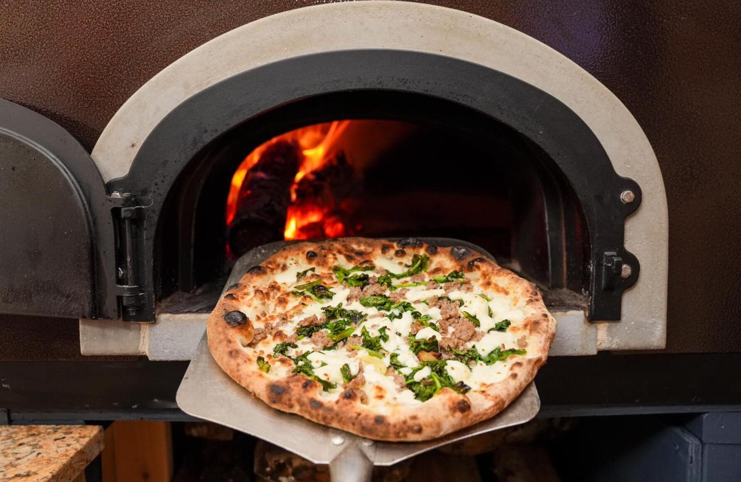 Business serving up hand-crafted, wood-fired pizzas finds new home in ...