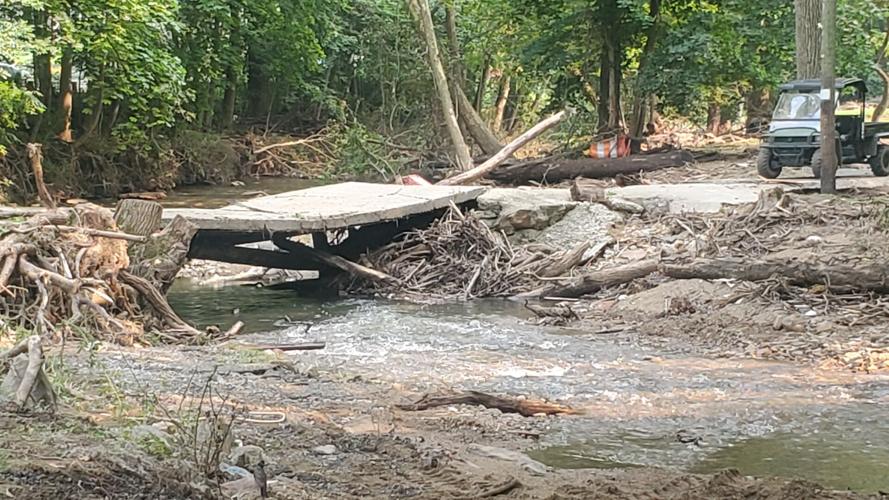 Debris, floodwaters knock out bridge to Exeter Twp. family's home ...