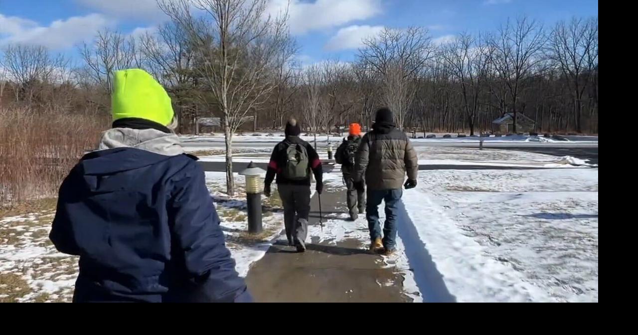 Hikers brave cold temperatures and snow-covered trails for 'First Day ...