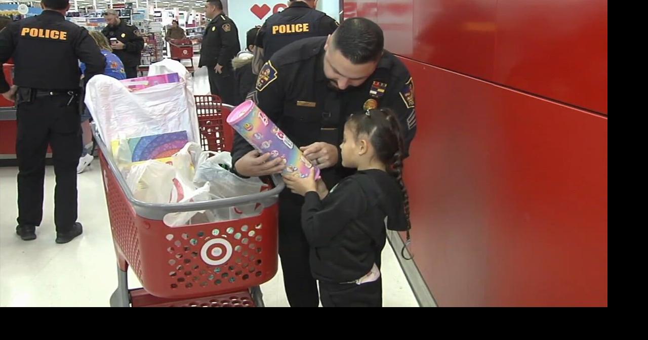 Kids load up their carts as they shop with an Allentown cop for ...