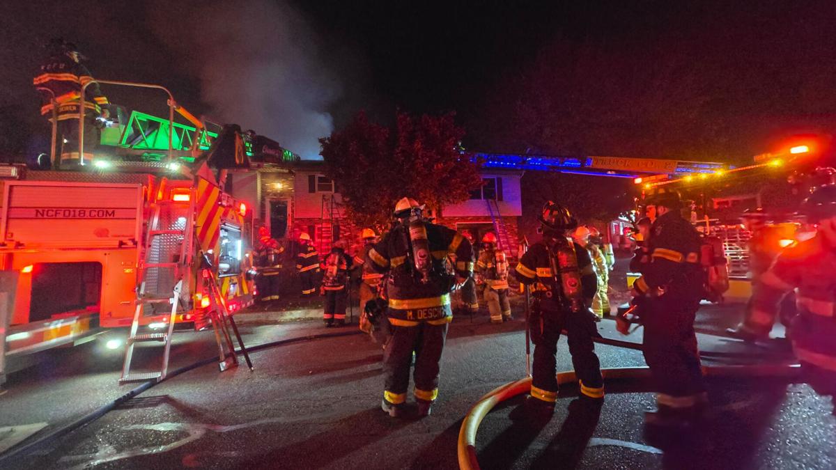 Firefighter reportedly injured, twin home heavily damaged after fire in ...