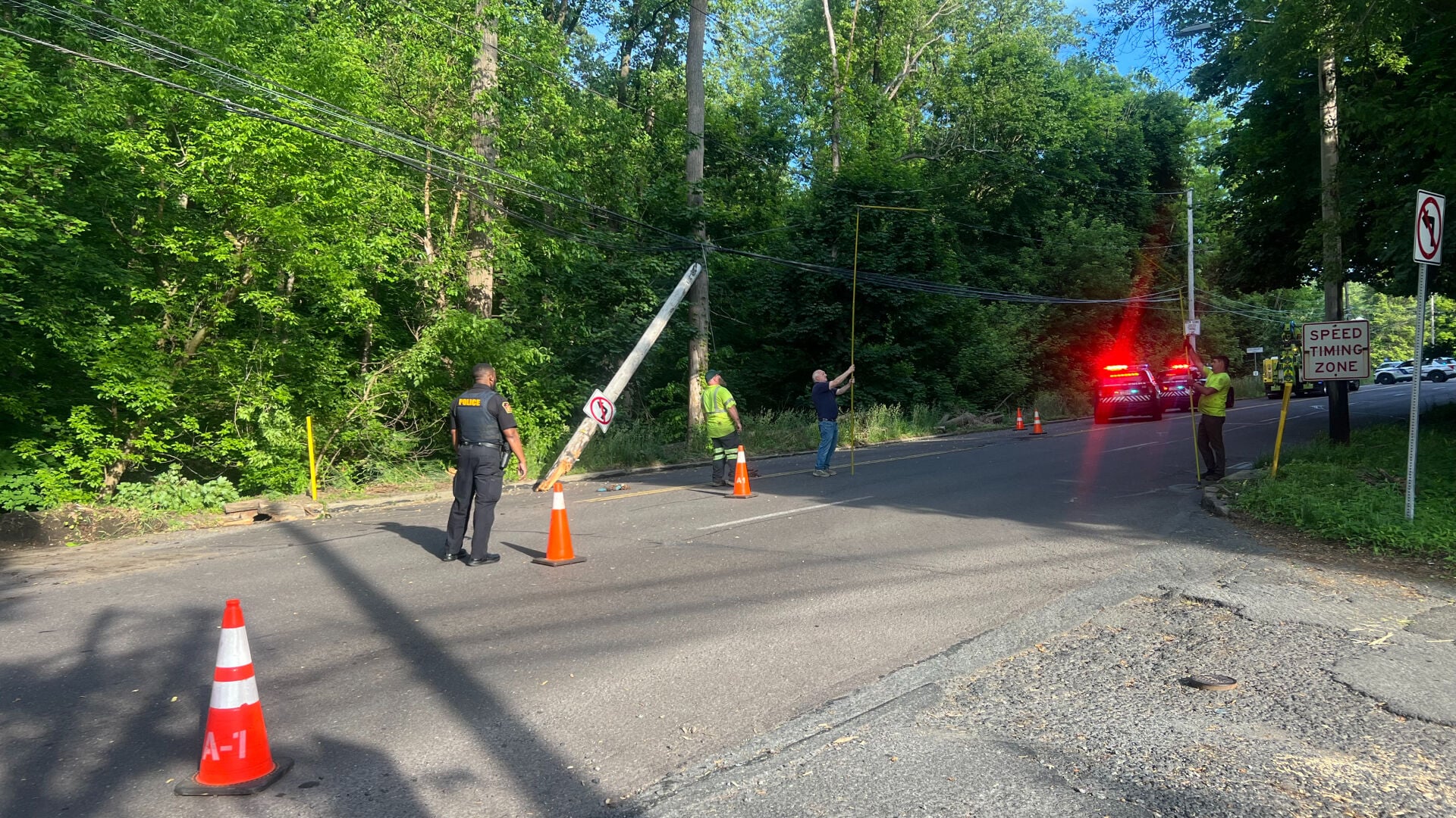 U-Haul trailer damages utility pole, temporarily closes road in ...