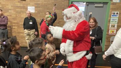 'Santa' visits Tyson Schoener Elementary School during annual Christmas ...