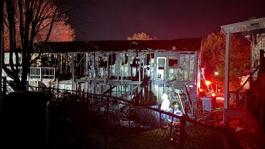 Firefighter reportedly injured, twin home heavily damaged after fire in ...