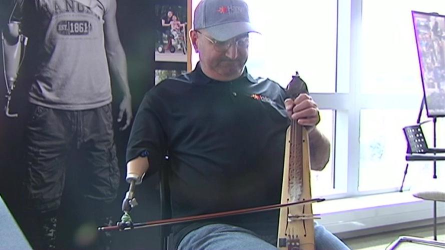 'Music gave me life': Prosthetic allows amputee to play instrument ...
