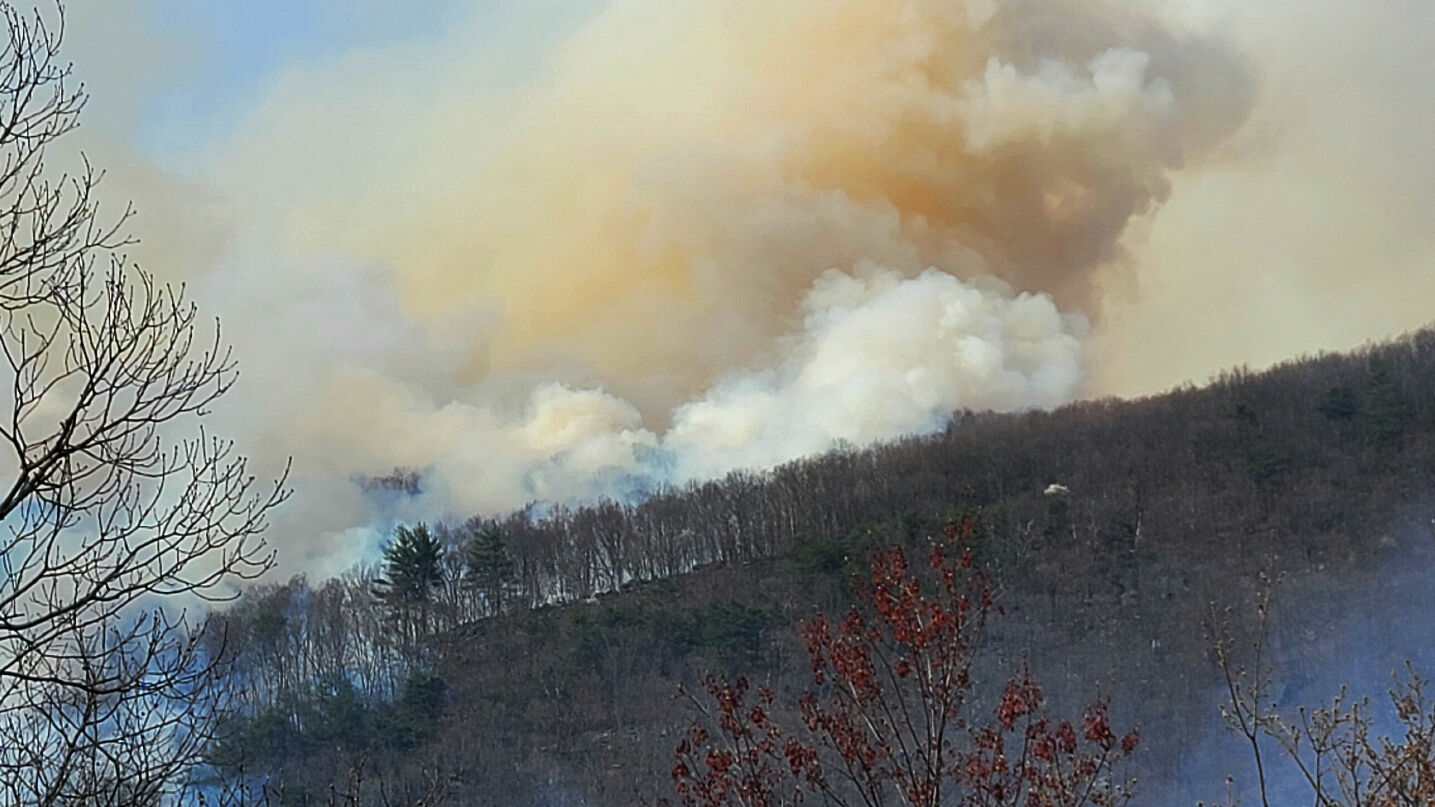 'Spread up the mountain': Multiple fire departments called in to battle ...