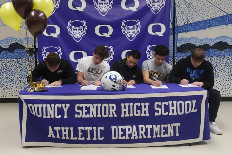 Five of QHS football's foundational pieces sign their NLI to play on ...