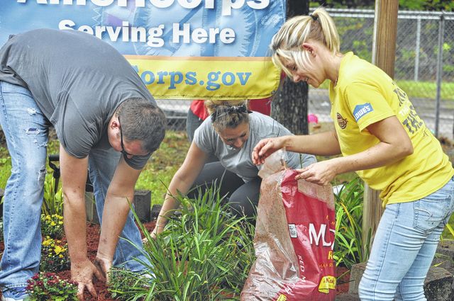 Lowes builds handicapped swing at Dingess Elementary | News ...