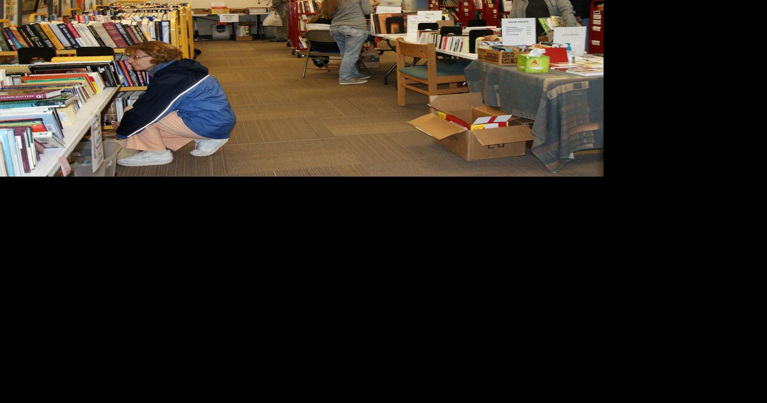 Fairview Public Library stocking shelves for biannual book sale ...