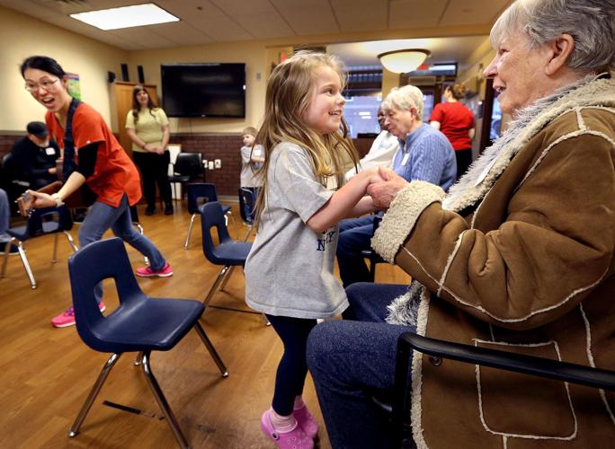 Generations collide, learn together at the Adult Care Center ...