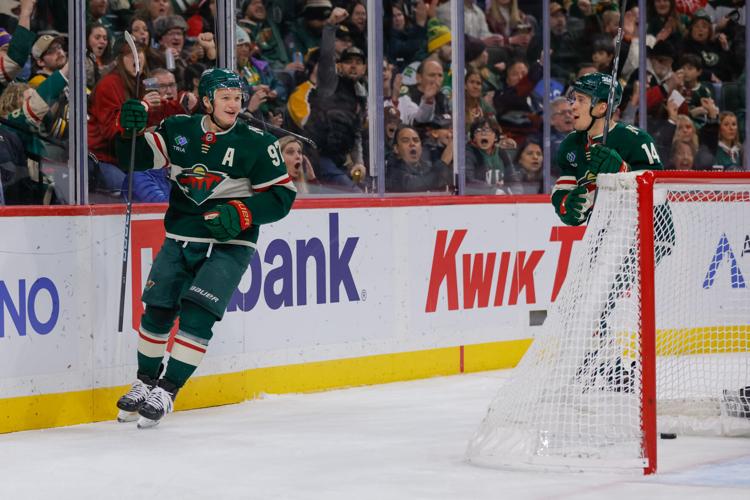 Quinn Hughes scores in Minnesota debut as Wild beat Bruins 6-2 for 4th ...