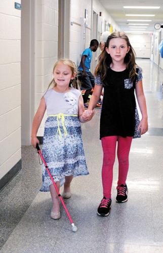 Local visually impaired girl finds hope with eSight | News ...