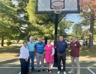 VIPs impressed by city park's basketball court improvements ...