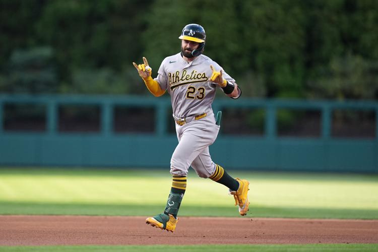 Ginn goes 8 innings and Gelof hits one of four A's homers in 12-1 rout ...