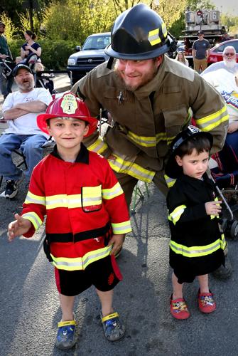 Hooked on ladders: Annual firefighter's parade draws thousands ...